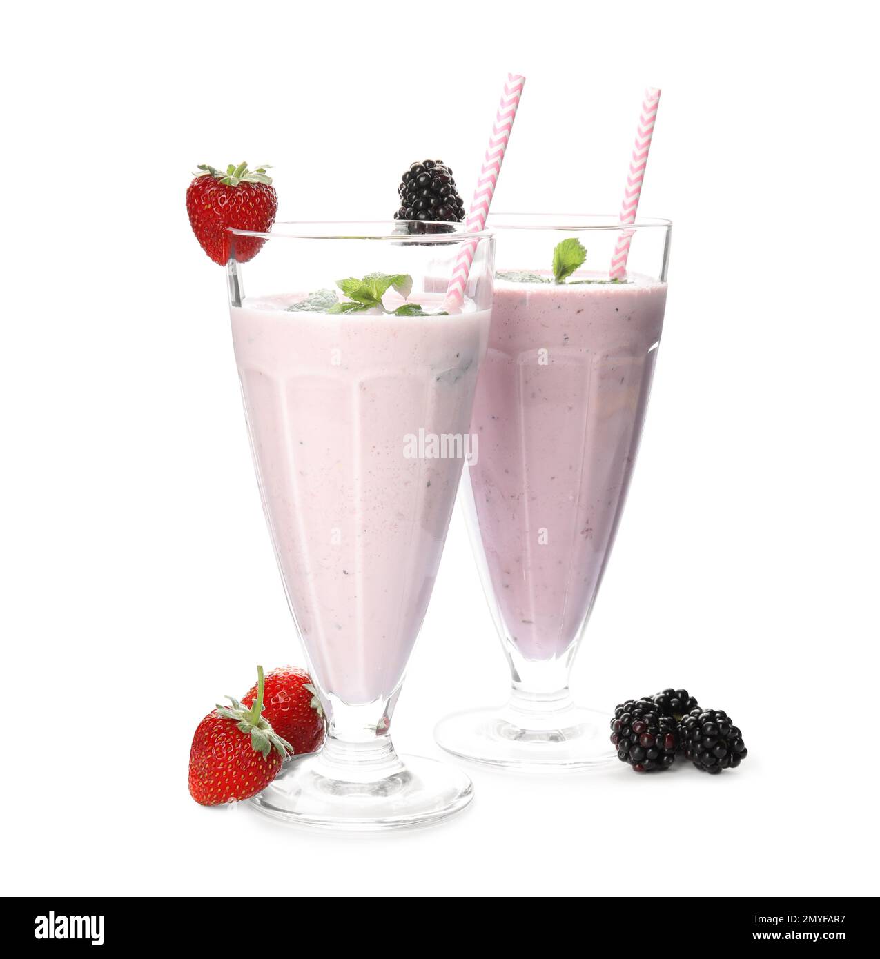Tasty fresh milk shakes and ingredients on white background Stock Photo ...