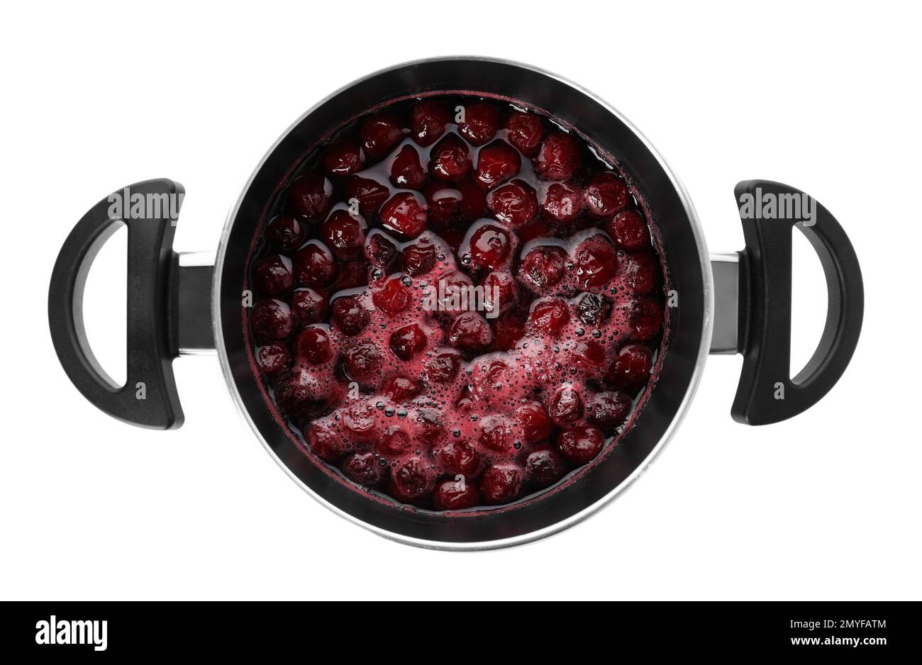 Pot with cherries in sugar syrup on white background, top view. Making ...