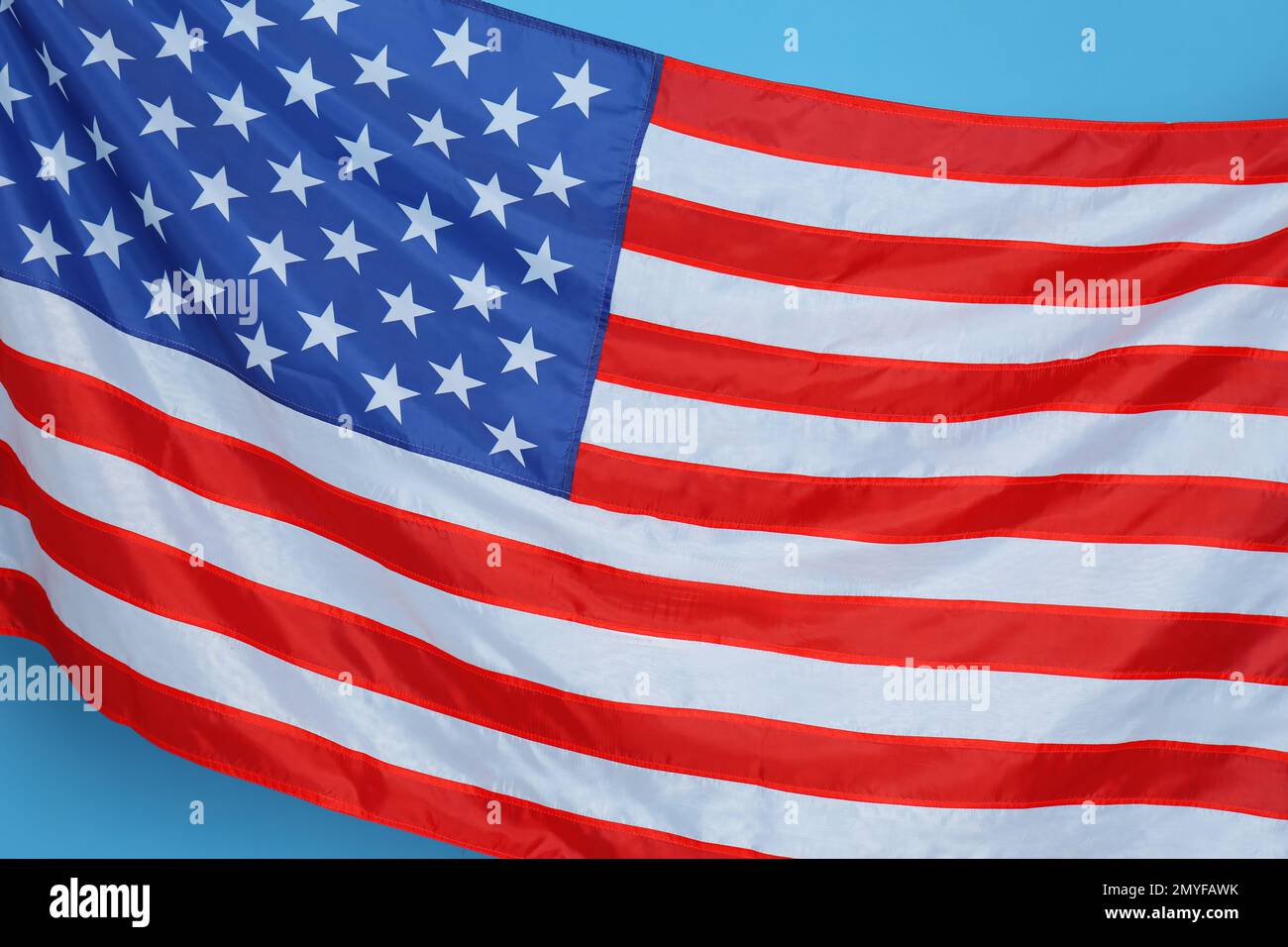 National United states of America flag on light blue background Stock ...