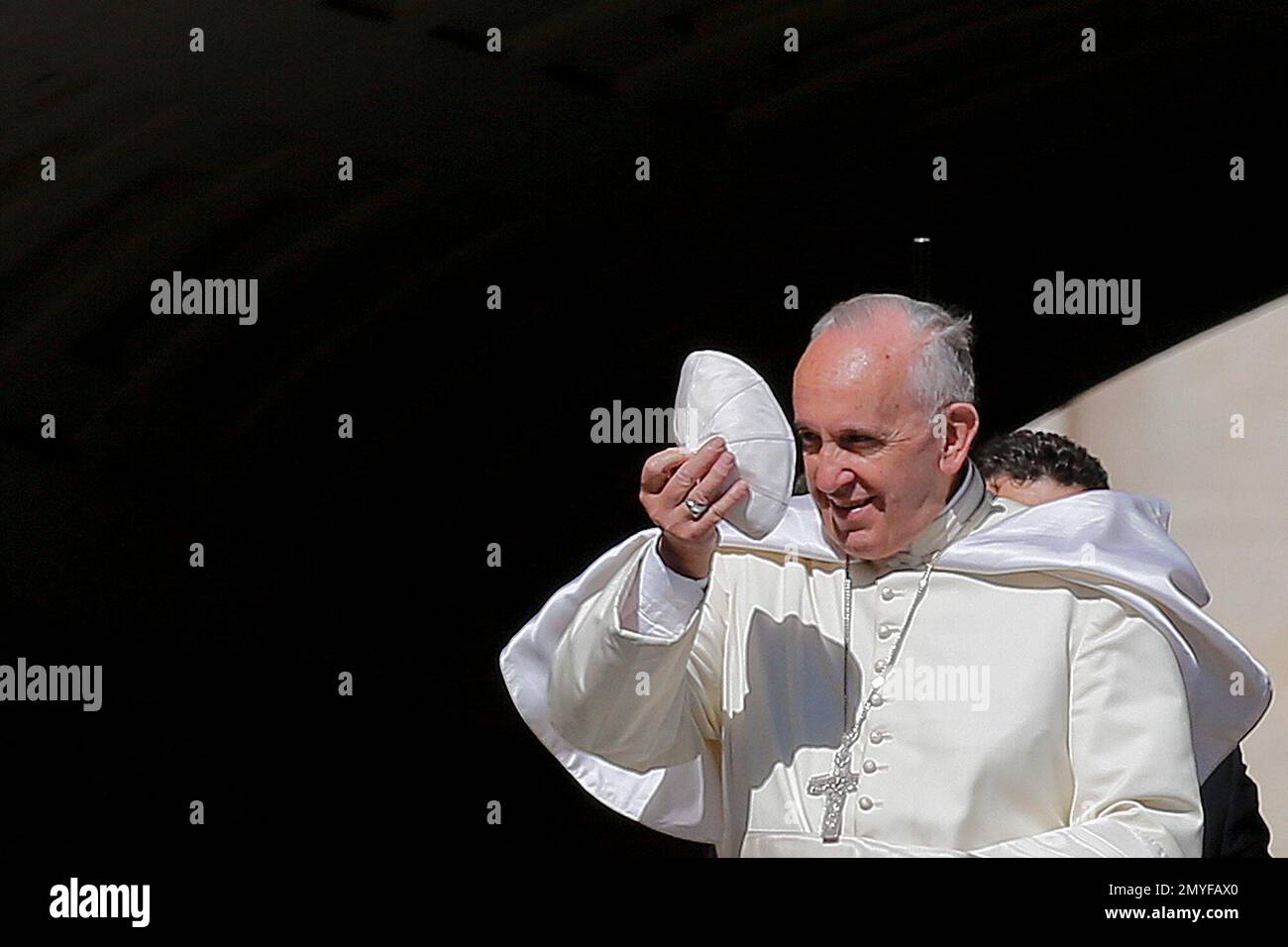 Pope Francis' cape is blown by a gust of wind as he arrives for a ...