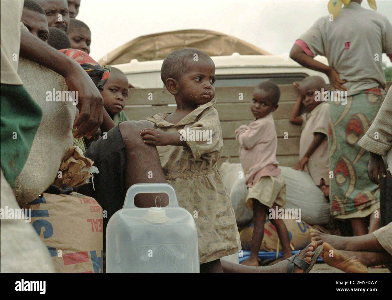 Hutu refugees wait in an UNHCR truck in Ruyenzi Transit Camp, Rwanda ...