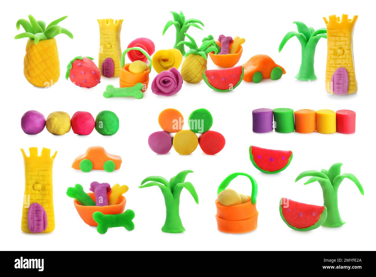 Collection of small figures made from play dough on white background ...