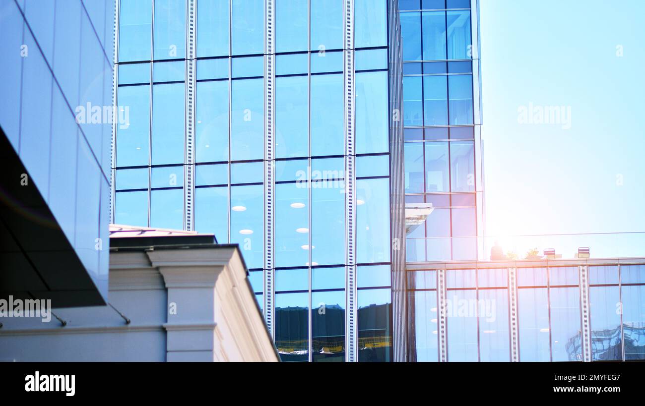 Glass building with transparent facade of the building and blue sky ...