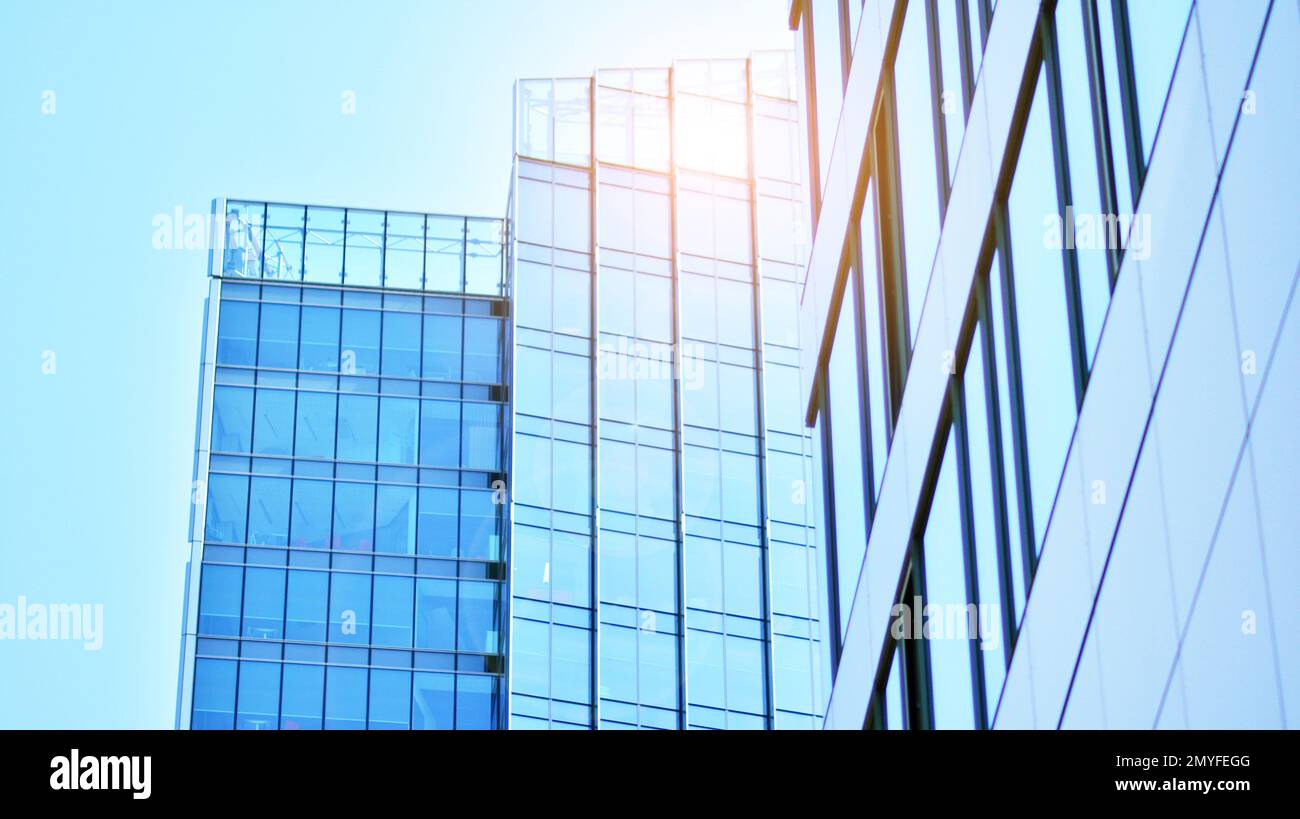 Glass building with transparent facade of the building and blue sky ...