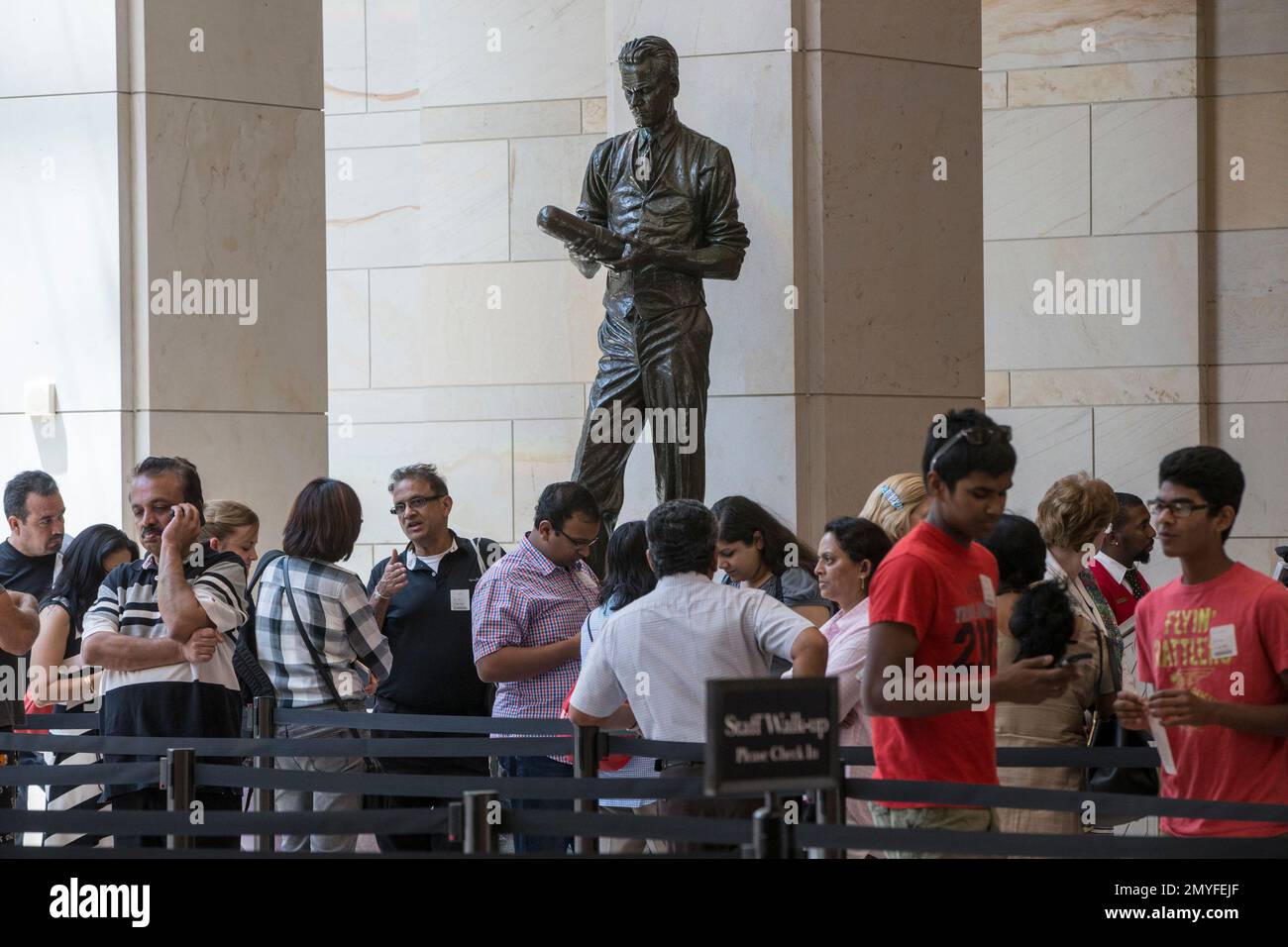 Tourists line up beneath a statue of Philo T. Farnsworth of Utah who ...