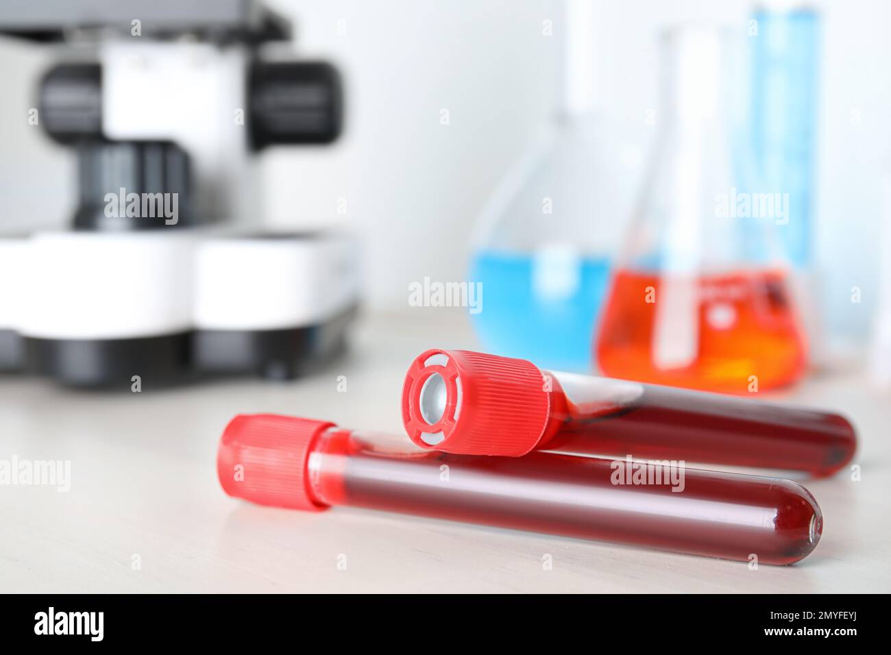 Test tubes with blood samples on table. Laboratory analysis Stock Photo ...