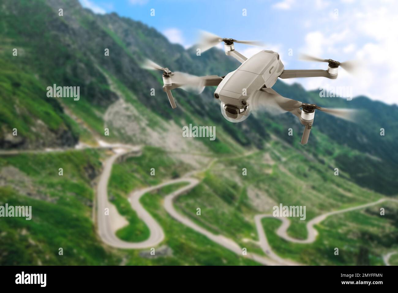 Modern drone flying over picturesque mountains. Aerial survey Stock ...
