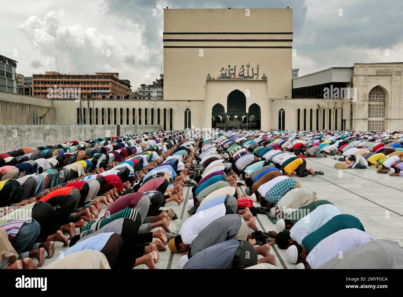 Bangladeshi Muslims offer prayers on the second Friday of the holy ...