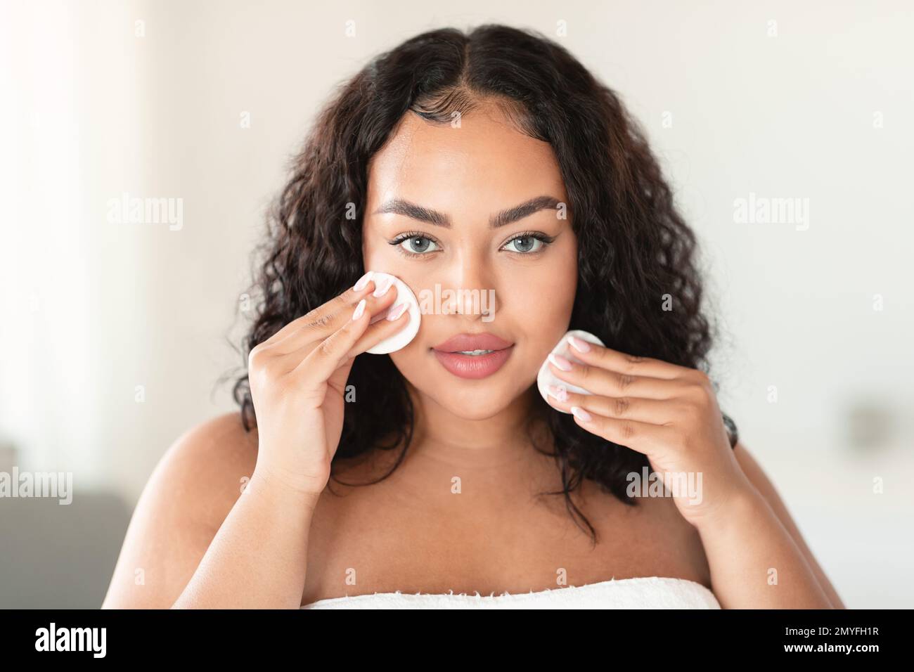 Skincare Concept Beautiful Overweight Lady Using Two Cotton Pads For Cleansing Skin Making