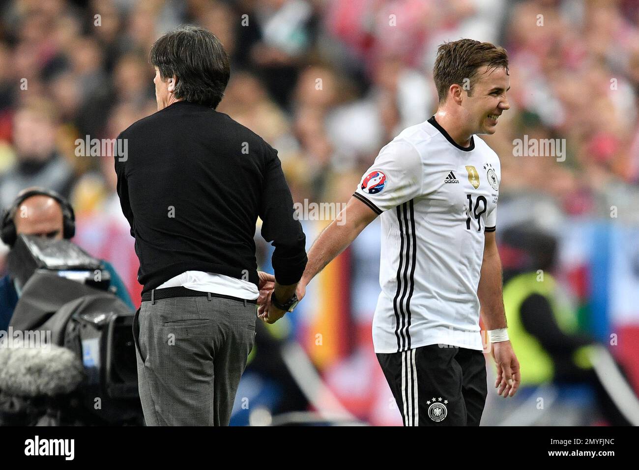 Germany coach Joachim Loew, left, shakes hands with Germany's Mario ...