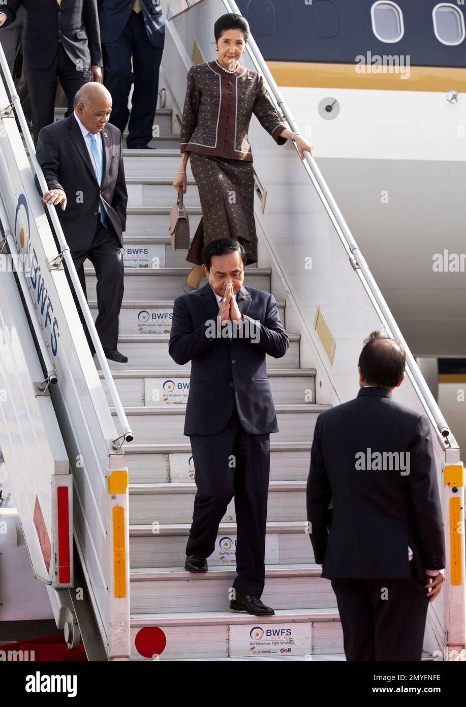 Prayut Chan-o-Cha, center, Prime Minister of Thailand, and his wife, Naraporn Chan-ocha, right ...
