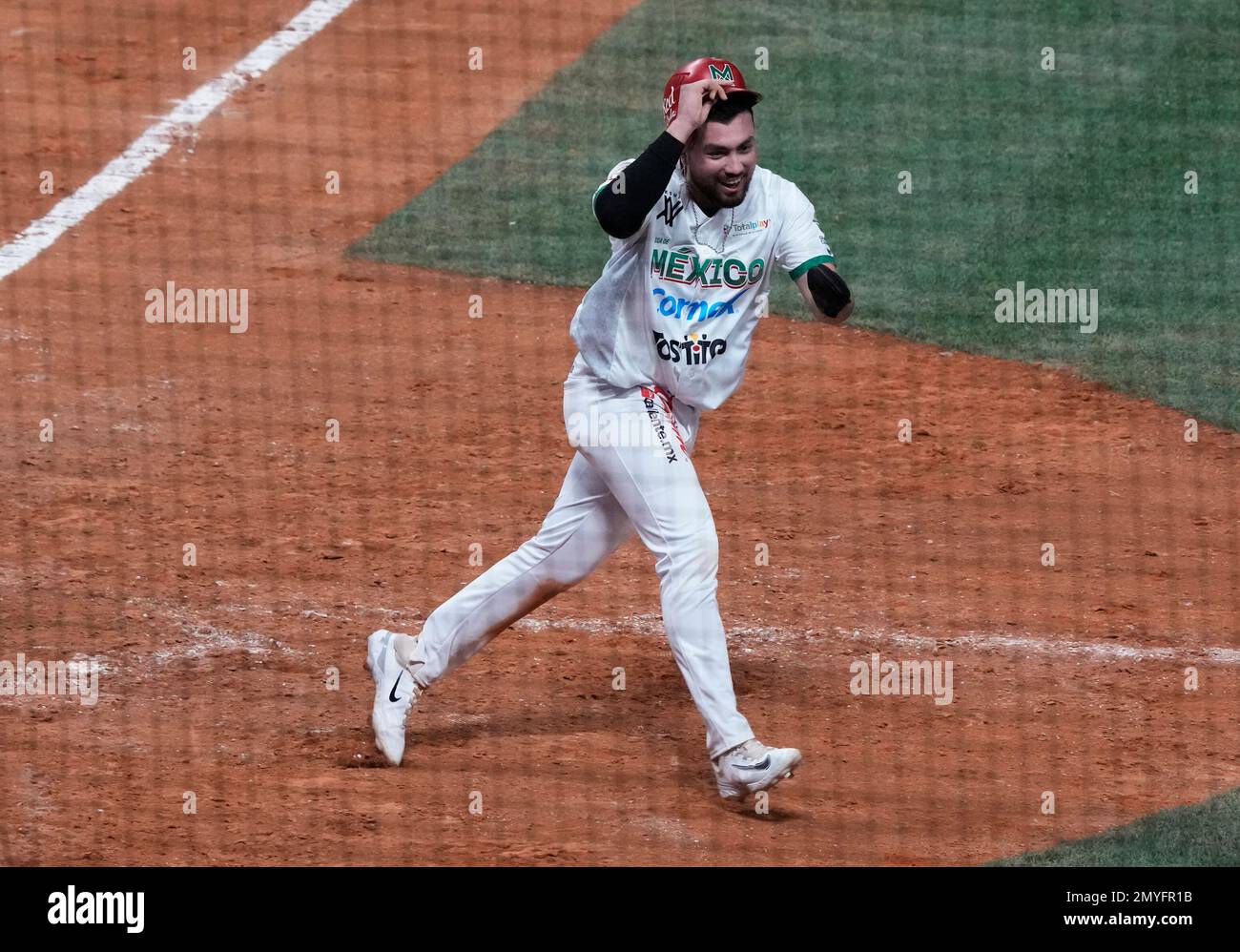 Mexico's Julian Ornelas celebrates at after scoring the winning run ...