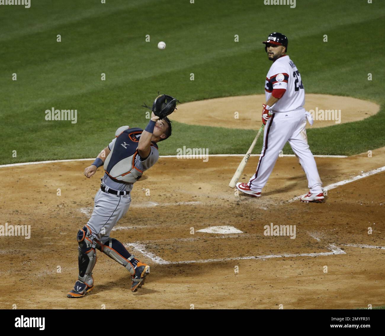 Detroit Tigers catcher James McCann, left, catches a pop up by Chicago ...