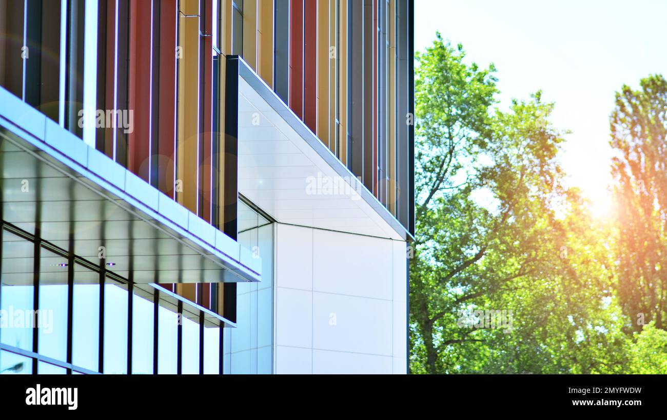 Eco architecture. Green tree and glass office building. The harmony of ...