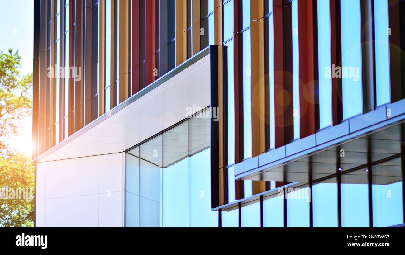 Eco architecture. Green tree and glass office building. The harmony of ...