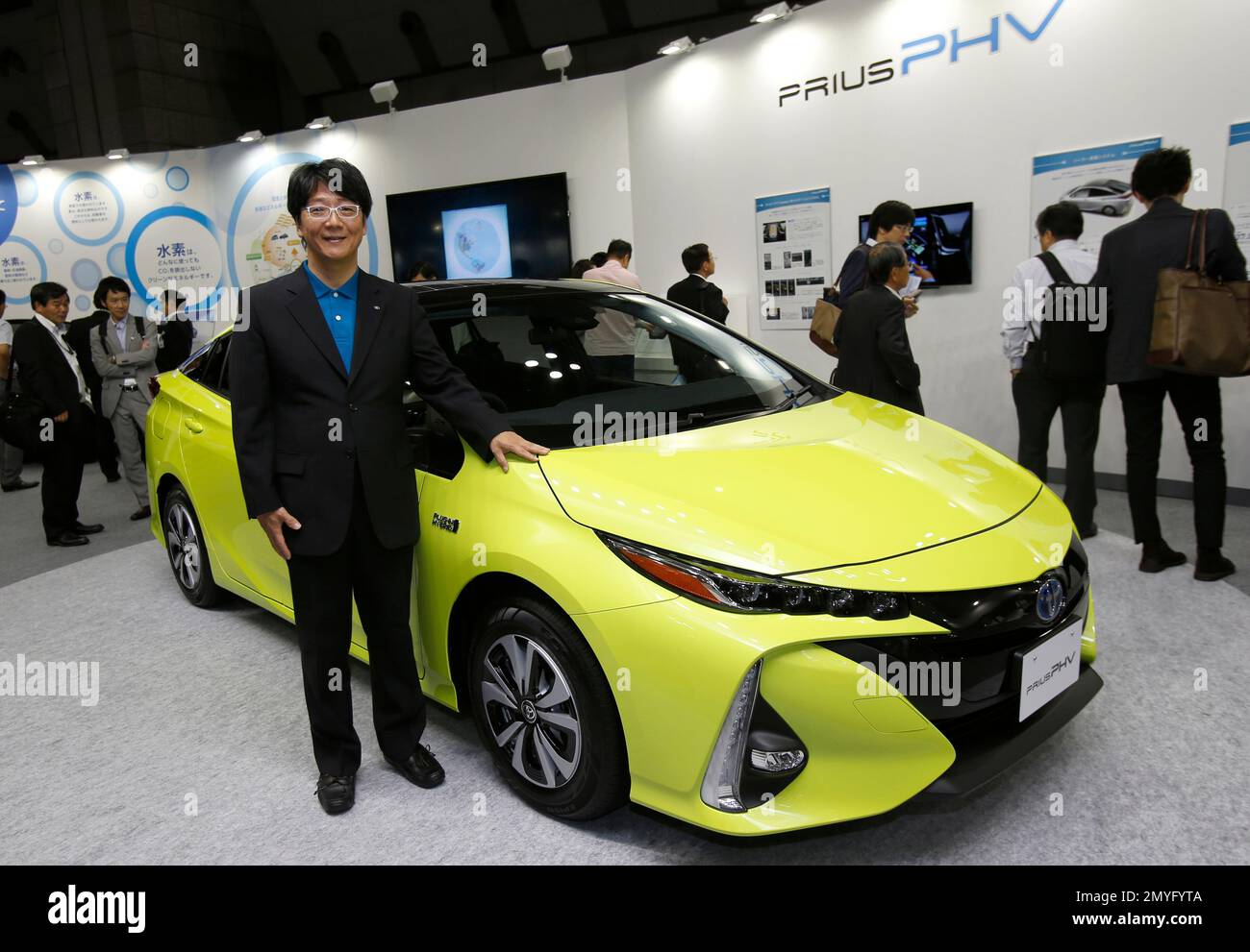 Toyota Motor Corp Chief Engineer Kouji Toyoshima poses with a Prius PHV ...