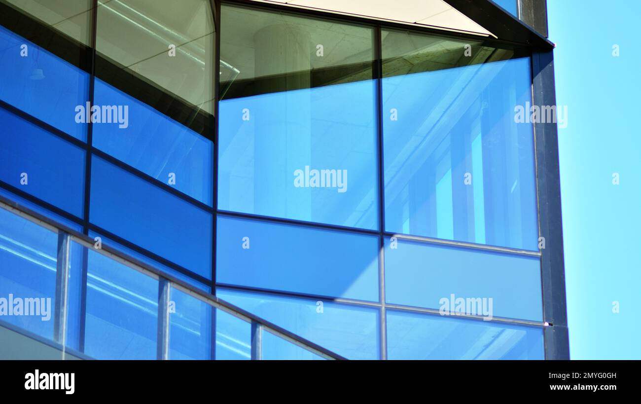 Minimalist glass facade, steel framework holding the large transparent ...