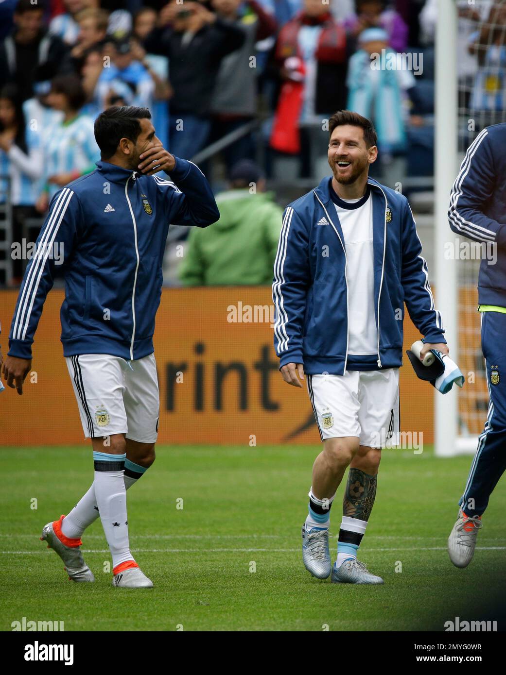 Argentina's Lionel Messi, right, enters the field with his teammates ...
