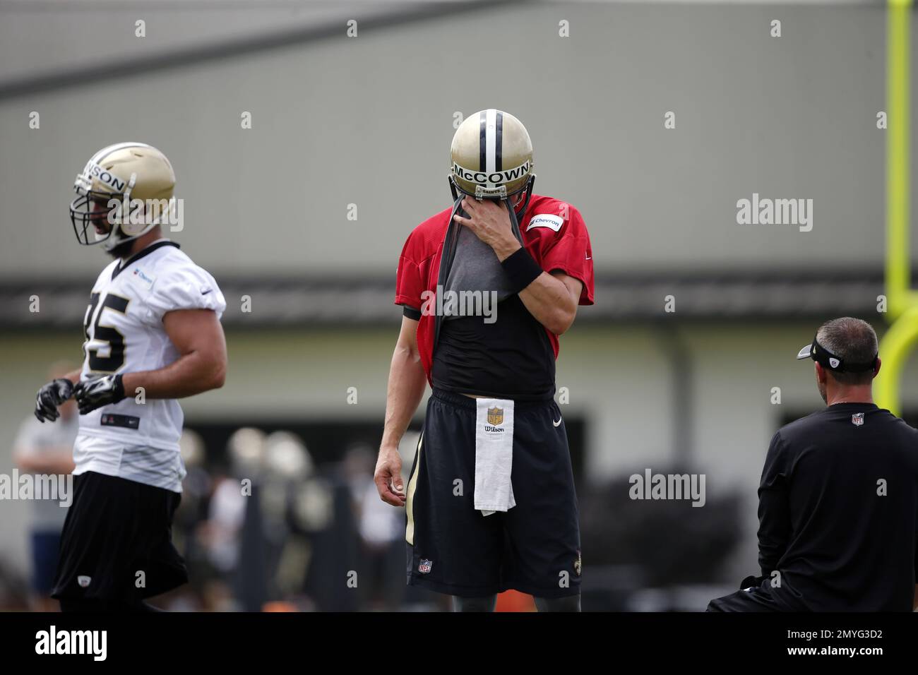 New Orleans Saints quarterback Luke McCown wipes his brow during the ...