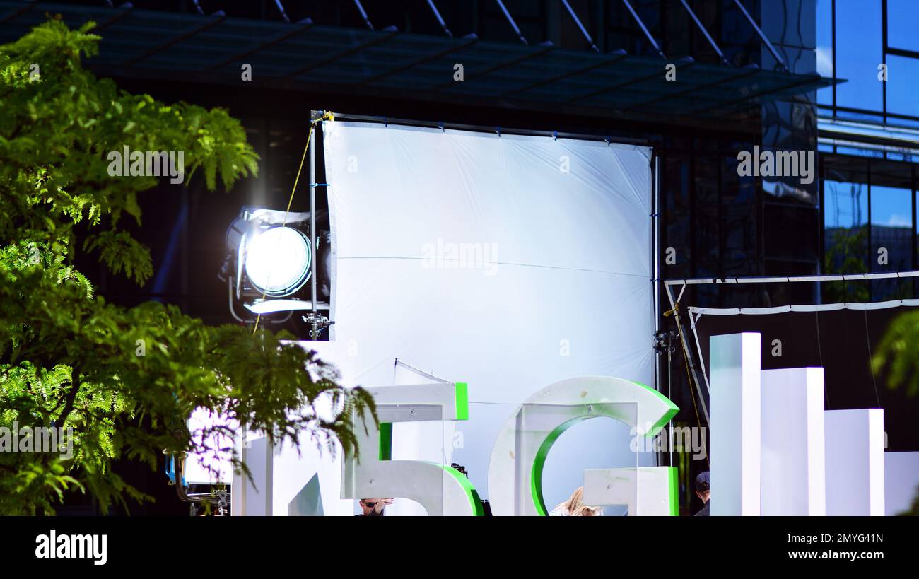 High powered spotlight illuminating an outdoor movie set Stock Photo ...