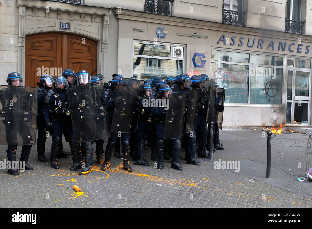 Riot police officers take position during a demonstration in Paris ...