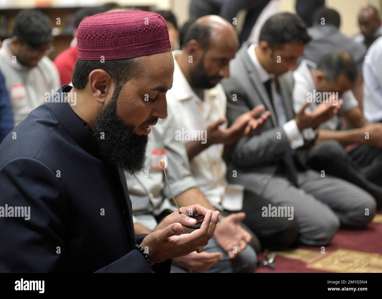 Imam Azhar Subedar, left, speaks during a special prayer with non ...