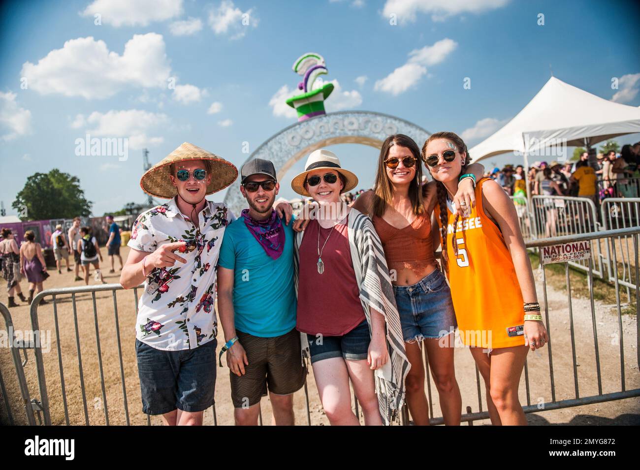 Fan goers pose at the main Bonnaroo arch at Bonnaroo Music and Arts ...