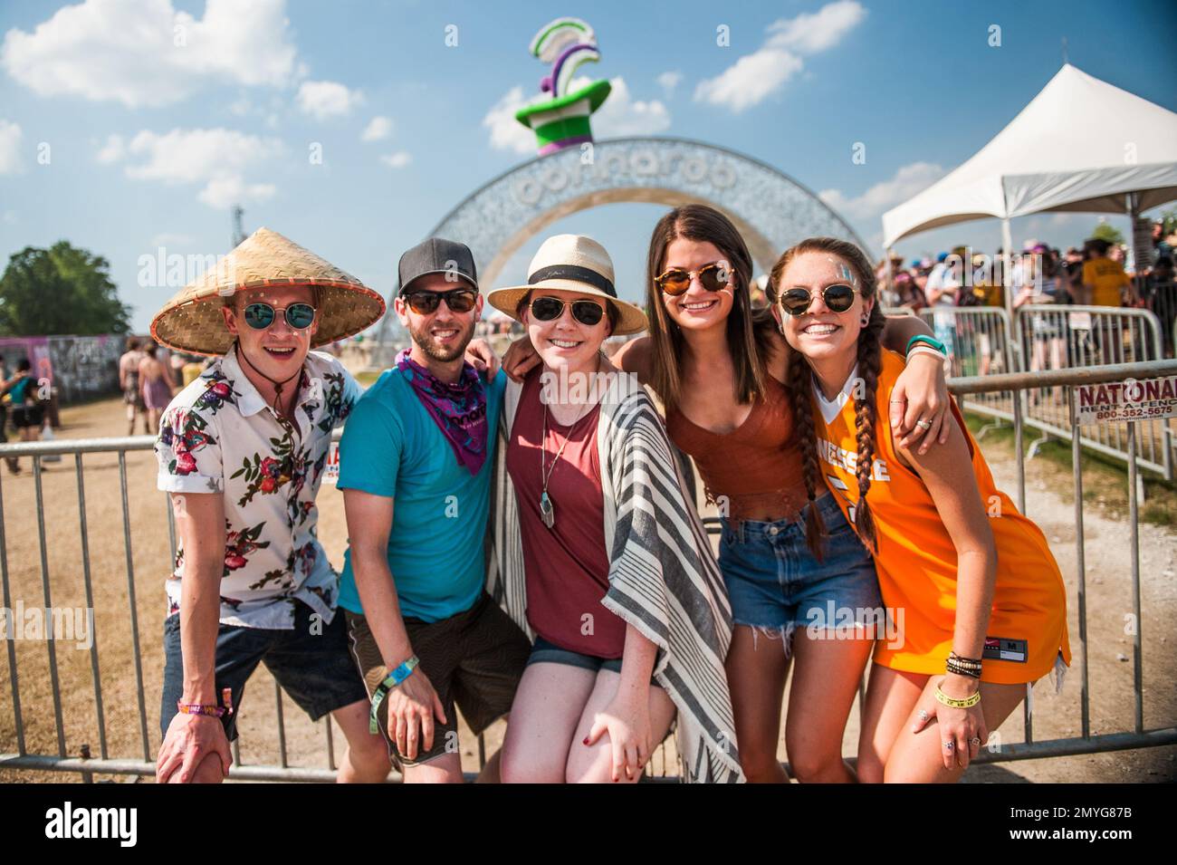 Fan goers pose at the main Bonnaroo arch at Bonnaroo Music and Arts ...
