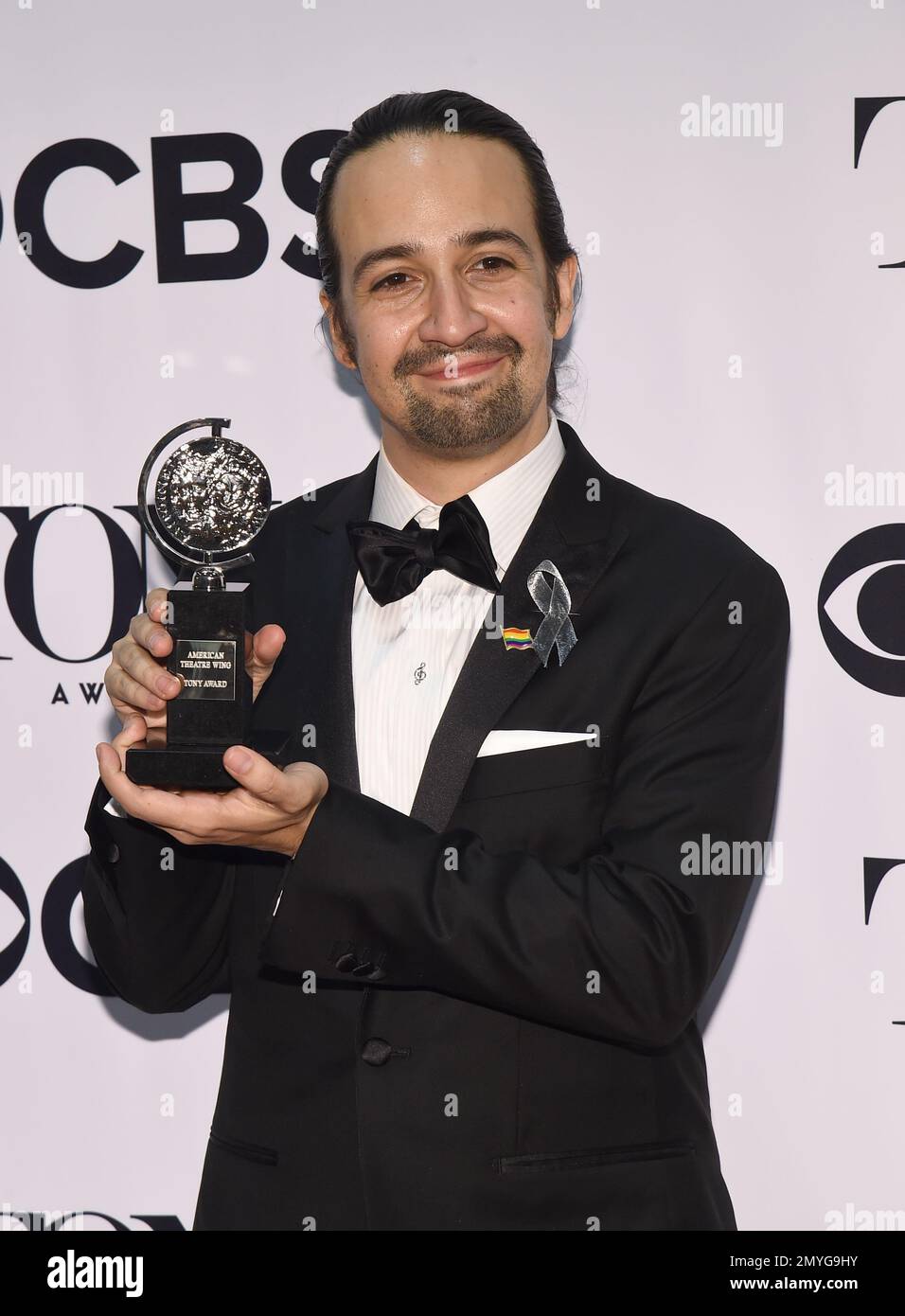 Lin-Manuel Miranda poses in the press room with the award for best ...