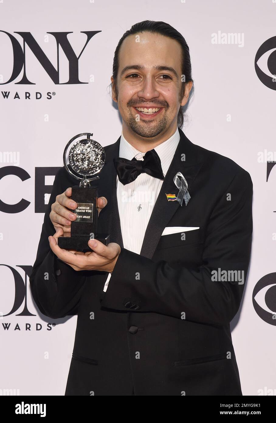 Lin-Manuel Miranda poses in the press room with the award for best ...