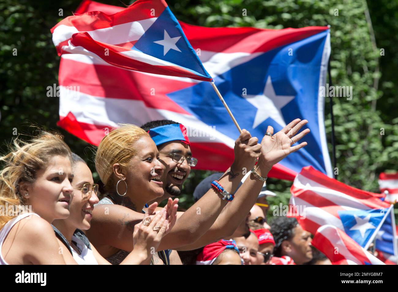 Jose Ramos, right, and Indy Ocasio, second from right, cheer as the ...
