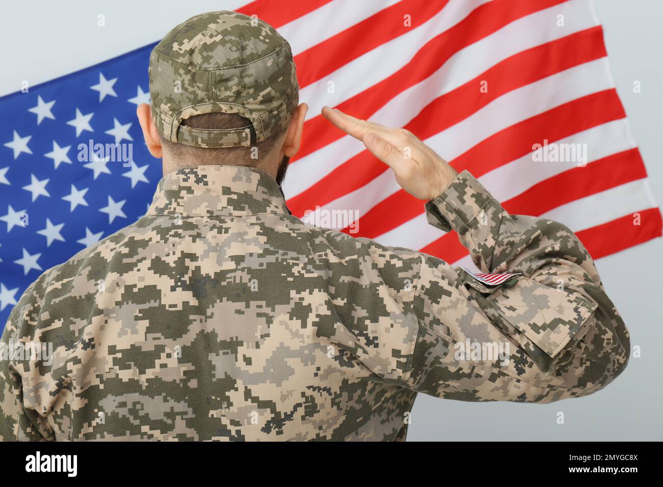 Soldier in uniform and United states of America flag on white ...