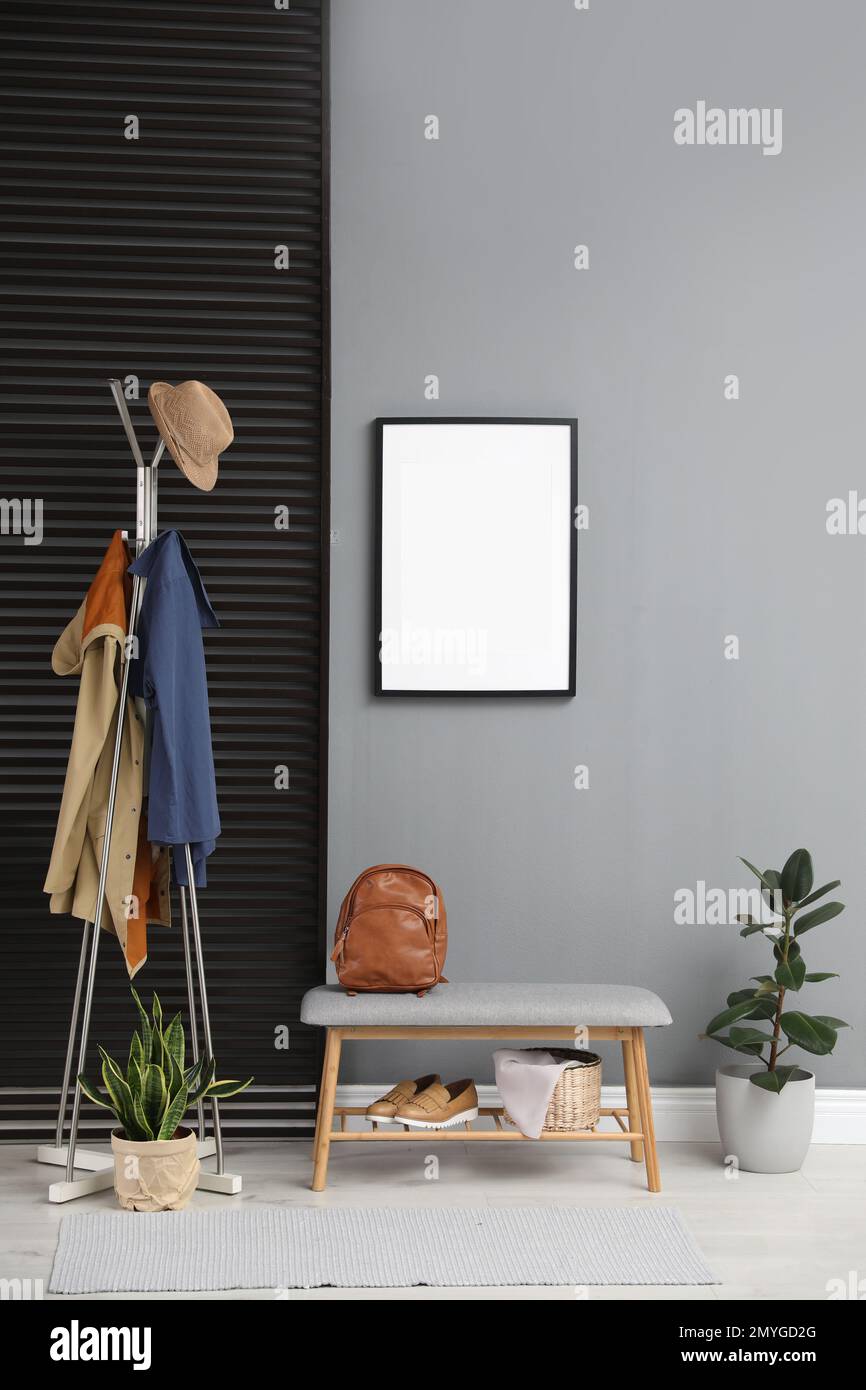 Stylish hallway interior with empty poster on wall. Mockup for design ...