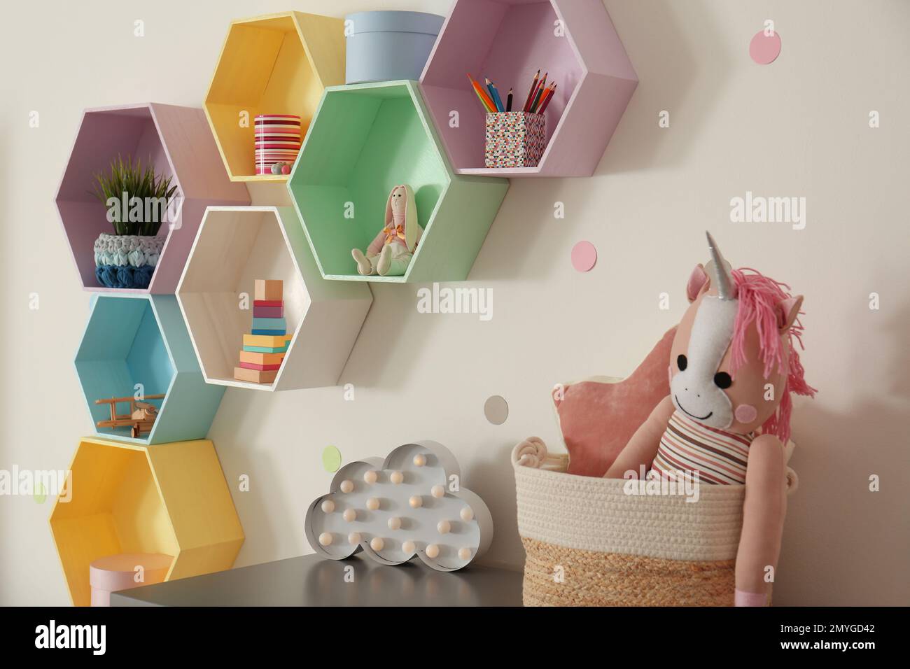 Bright colorful shelves on light wall in room. Interior design Stock ...