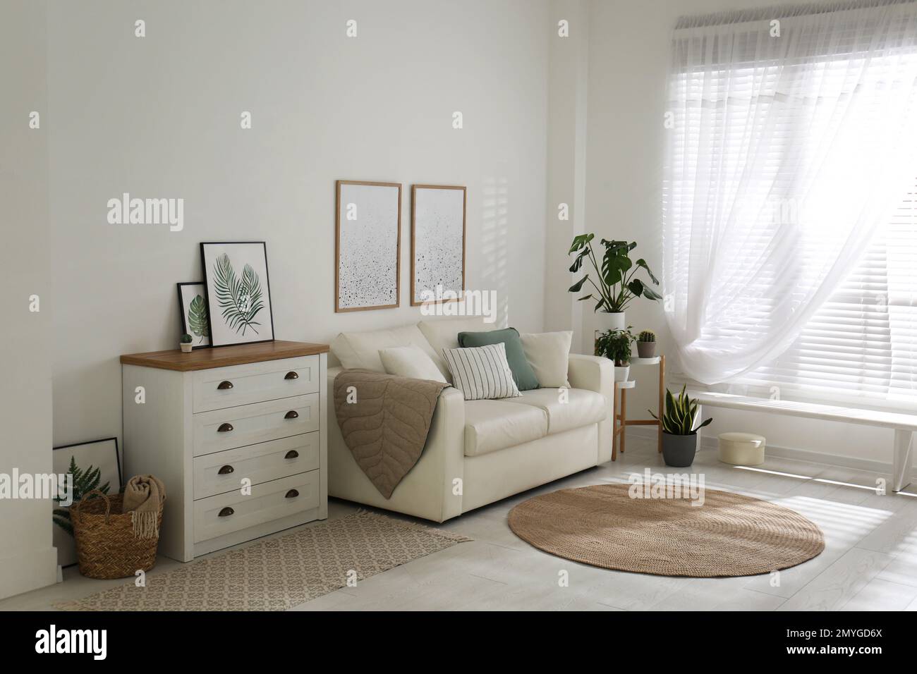 Modern chest of drawers in living room. Interior design Stock Photo - Alamy