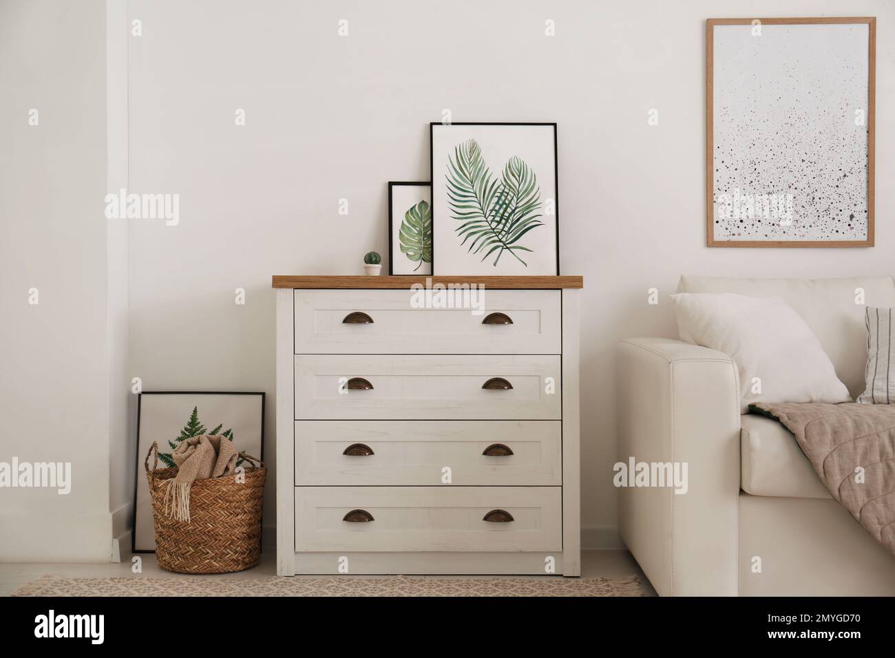 Modern chest of drawers in living room. Interior design Stock Photo - Alamy