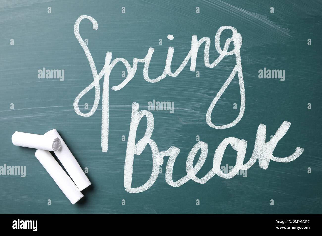 Text Spring Break and chalk on greenboard, top view. School holiday ...