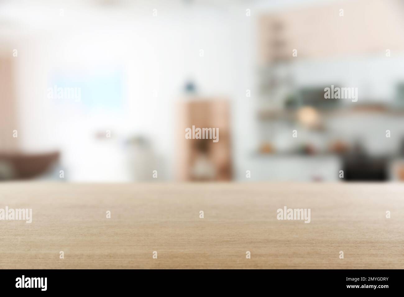 Wooden desk and blurred room on background. Home furniture Stock Photo ...