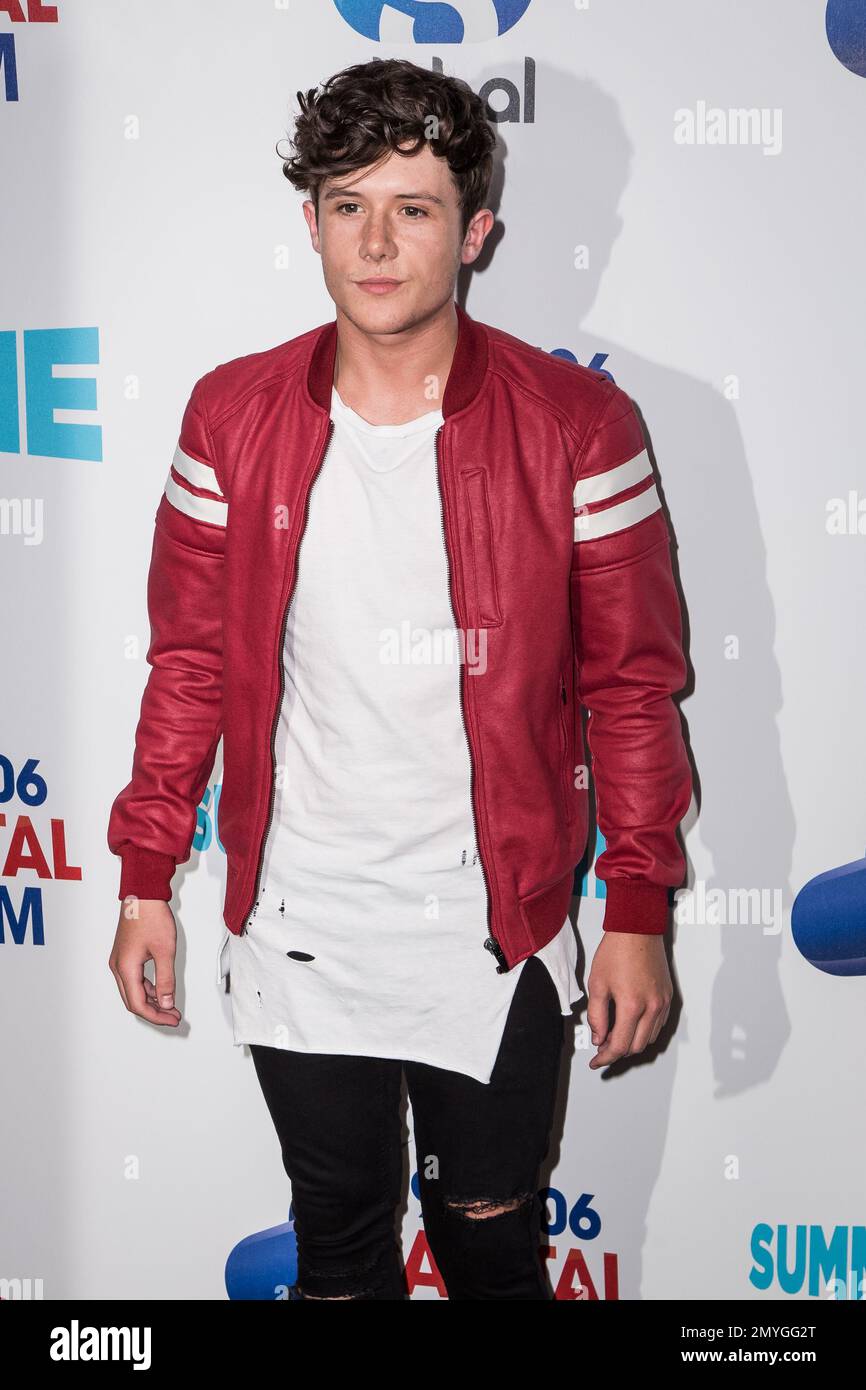 Singer Ryan Lawrie poses for photographers before performing on stage ...