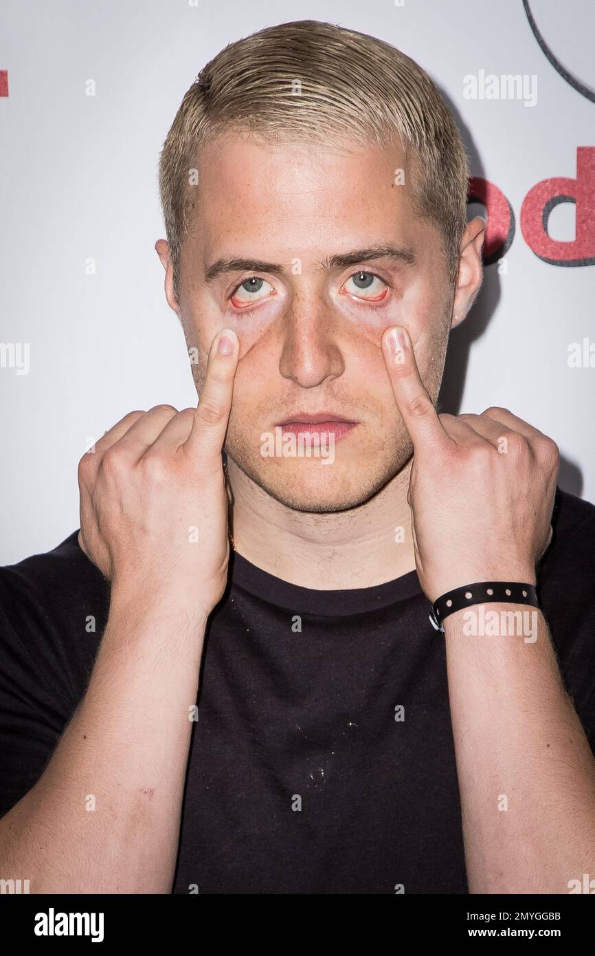 Singer Mike Posner poses for photographers before performing on stage ...