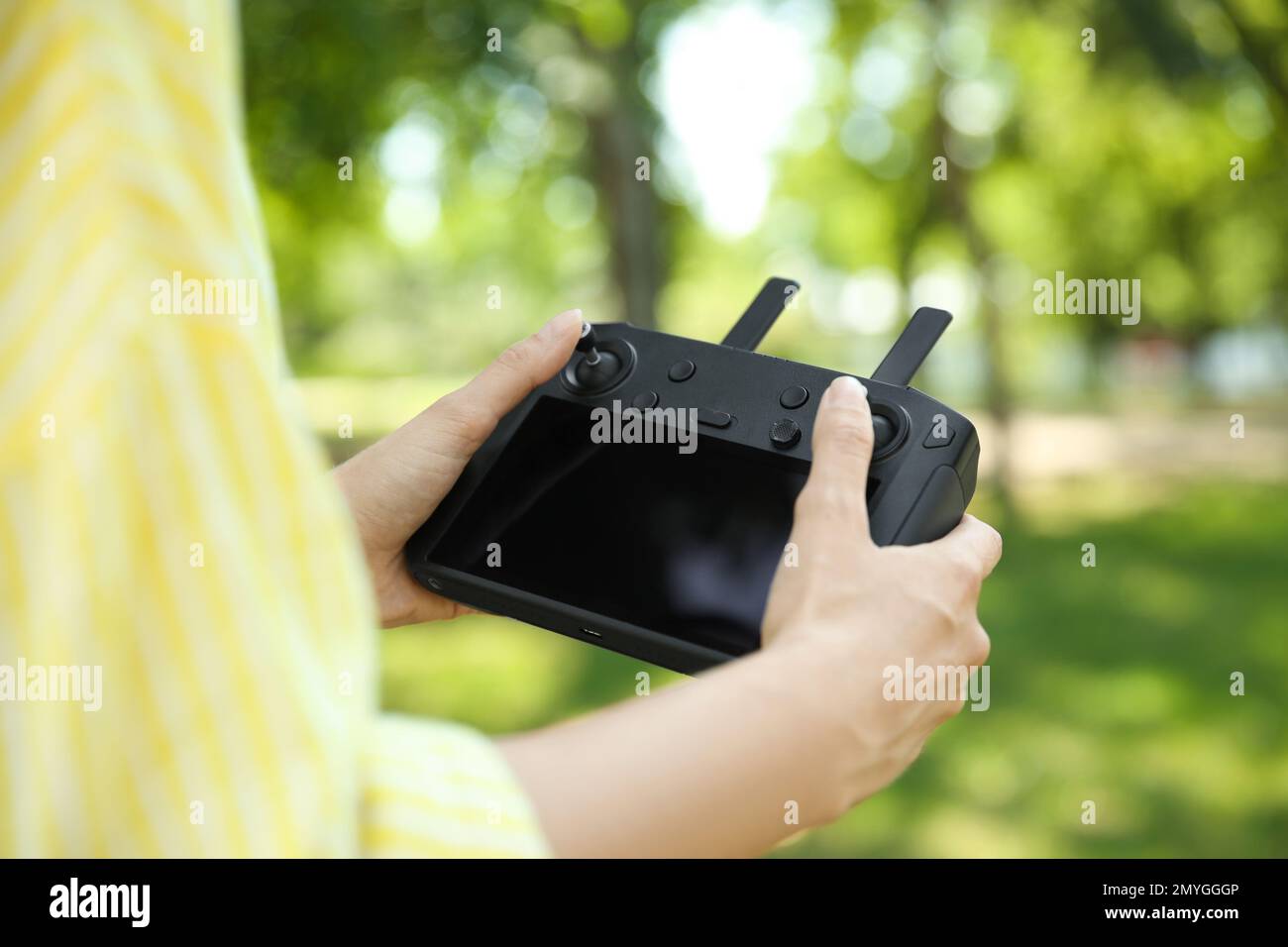 Young woman holding controller drone hi-res stock photography and ...