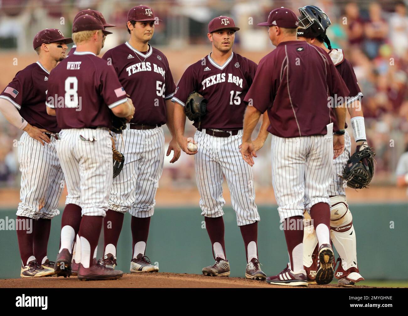 Texas A&M head coach Rob Childress, right, speaks to his infield during ...