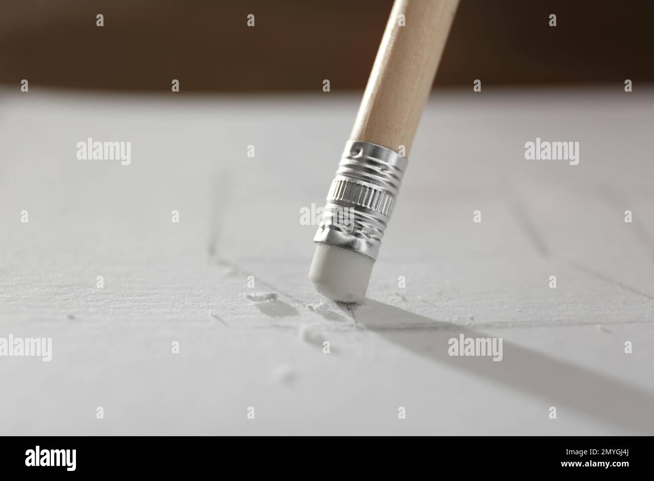 Correcting picture on paper with pencil eraser, closeup Stock Photo - Alamy