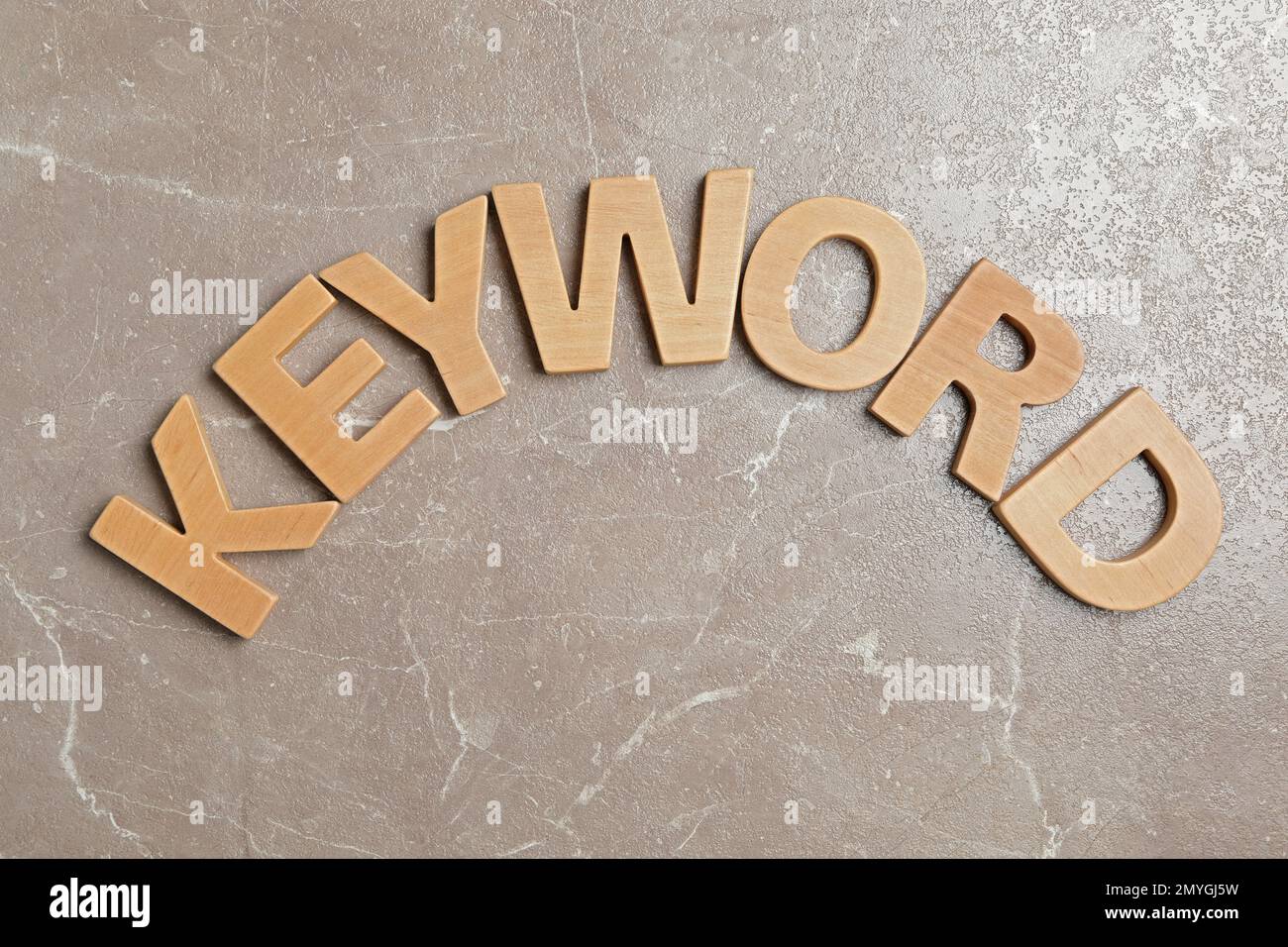 Word KEYWORD made of wooden letters on marble background, flat lay ...