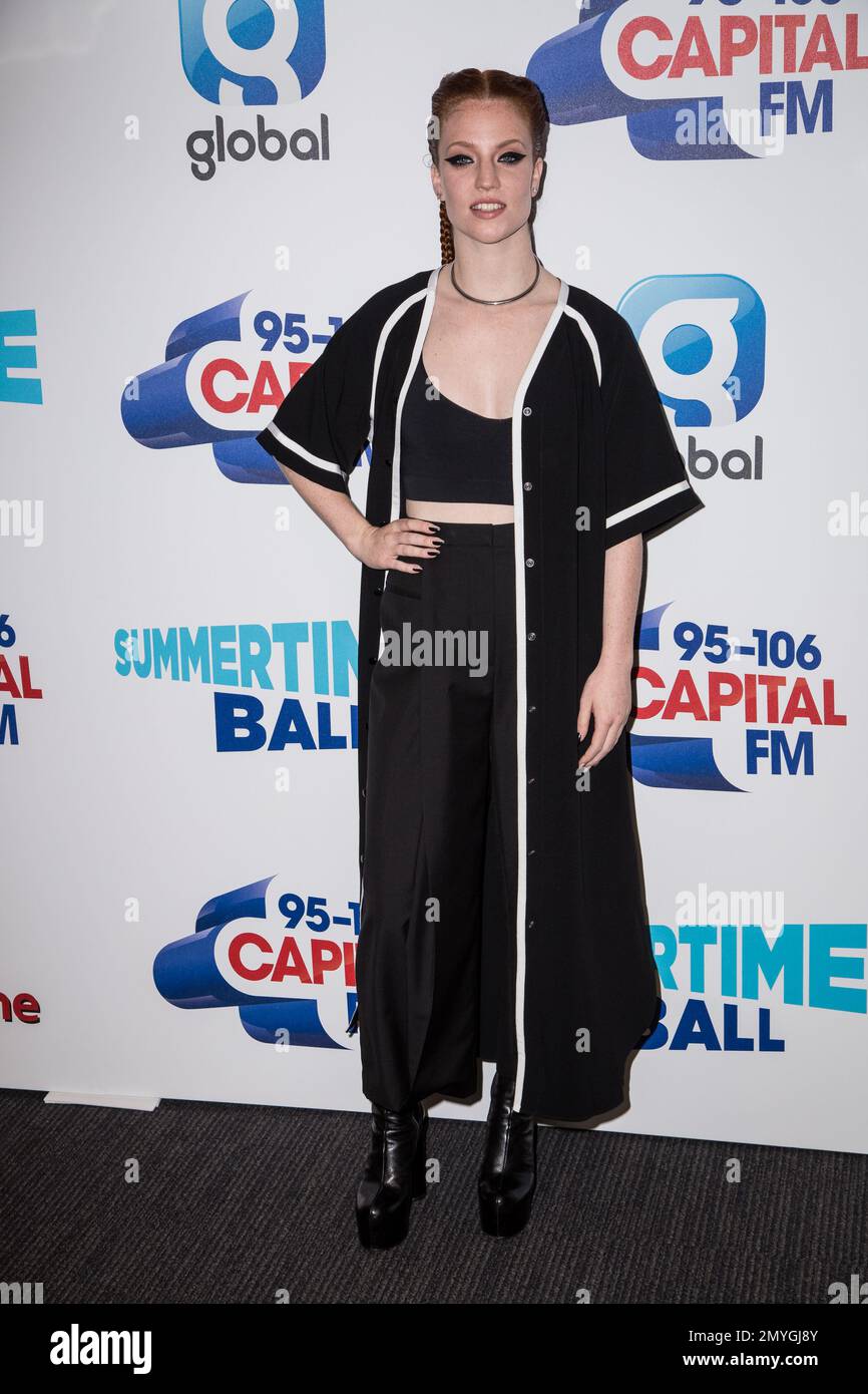 Singer Jess Glynne poses for photographers before performing on stage ...
