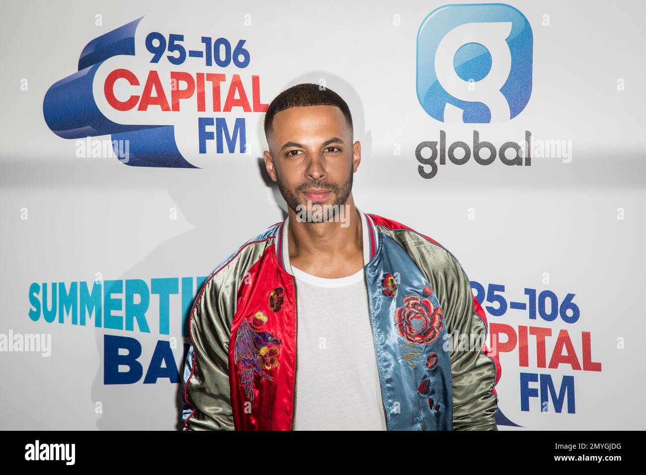 Singer Marvin Humes poses for photographers before performing on stage ...