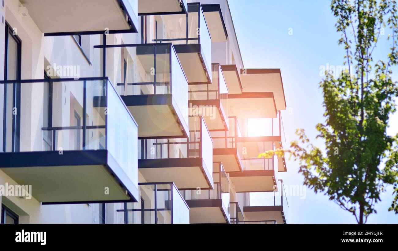 Eco architecture. Green tree and apartment building. The harmony of ...