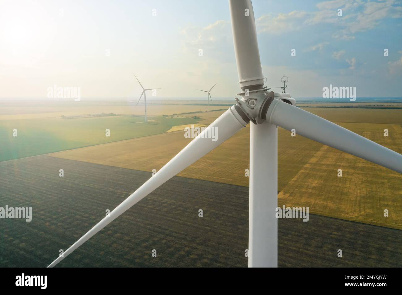 Modern windmill in field, closeup. Energy efficiency Stock Photo - Alamy