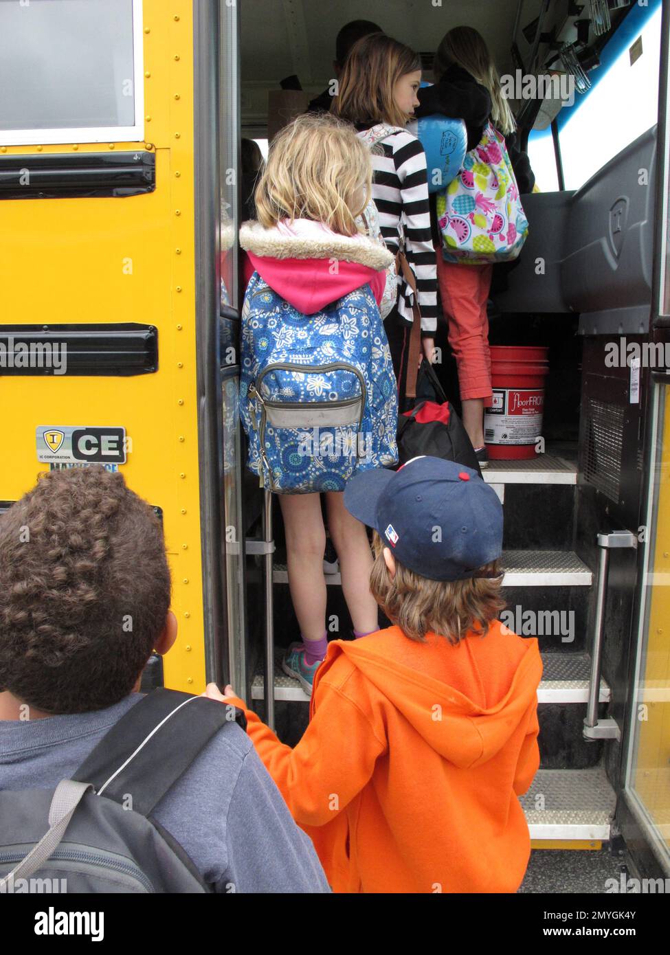 In this June 9, 2016, photo, students enter their bus after being let ...