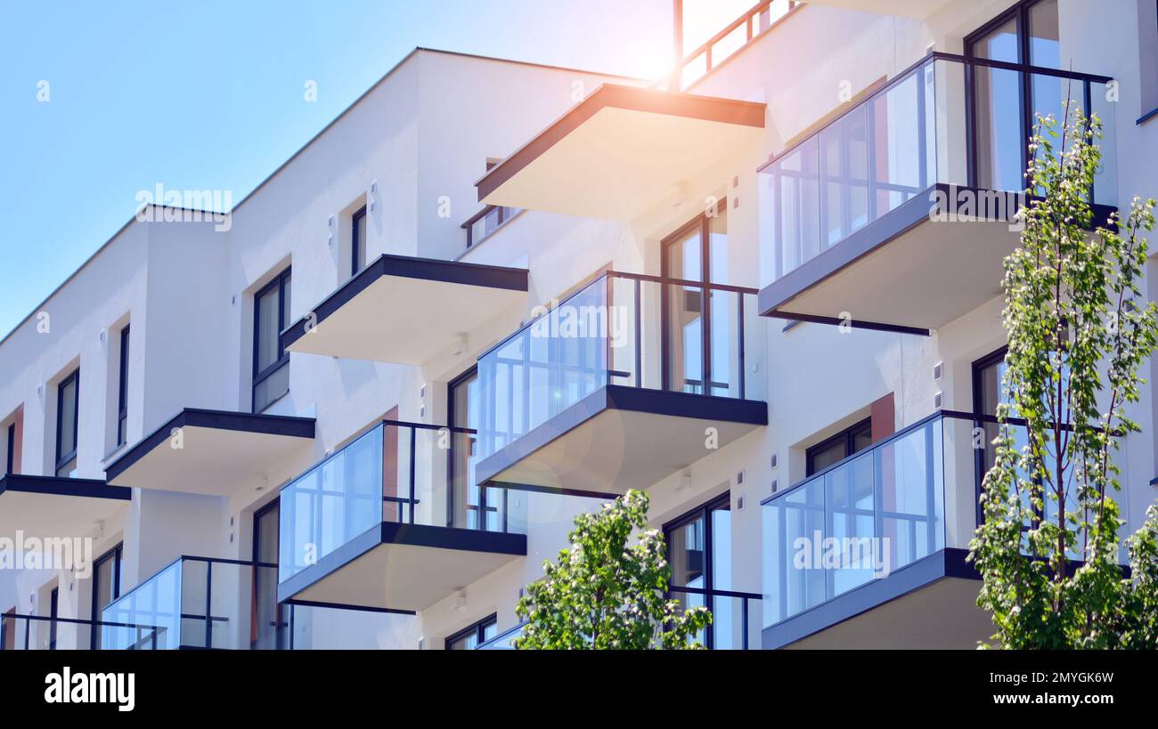 Eco architecture. Green tree and apartment building. The harmony of ...